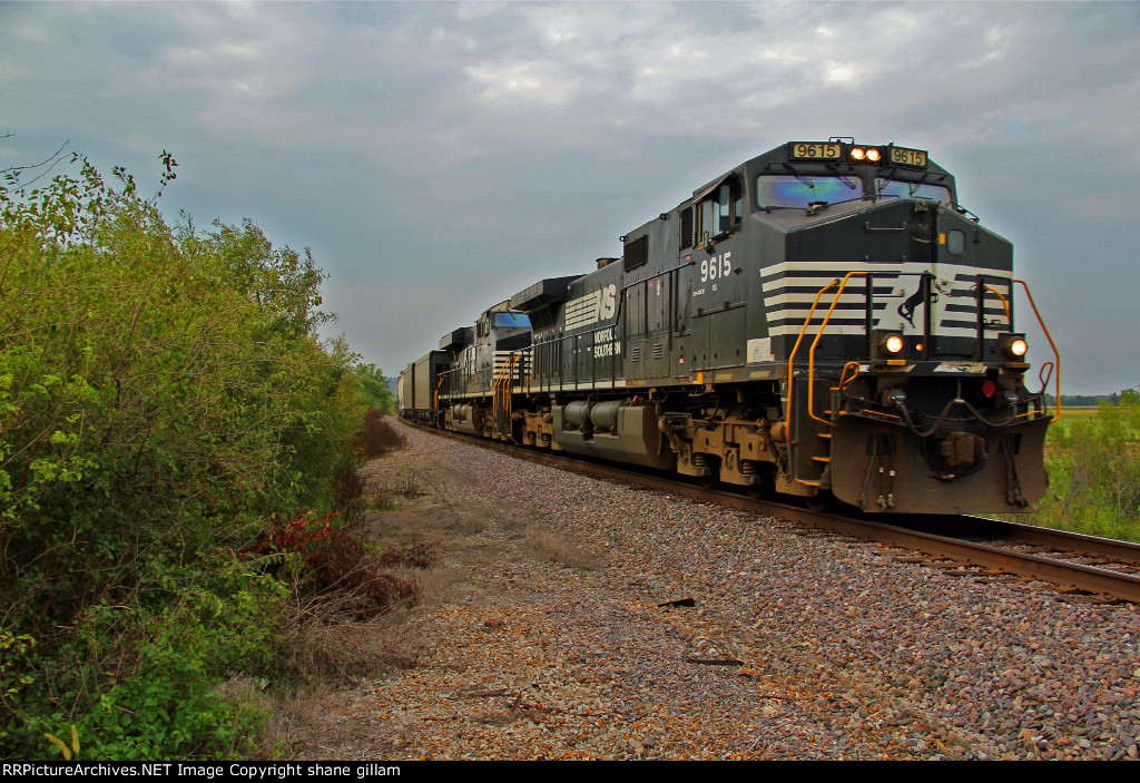 NS 9615 leads a small freight sb.